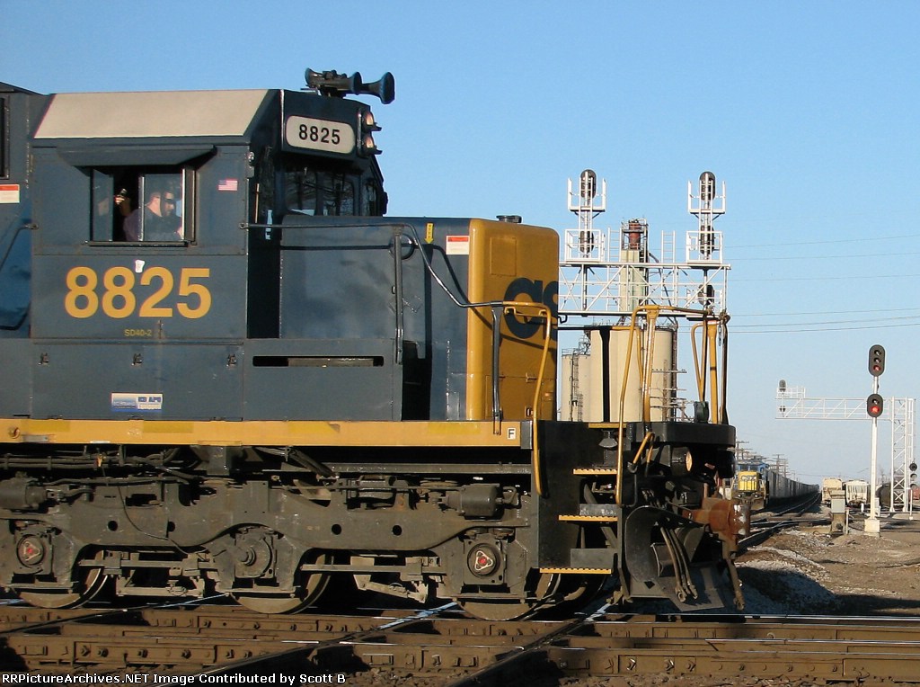 CSX 8825 Q396 crosses the NS diamonds as NS 261 stopps At Town street